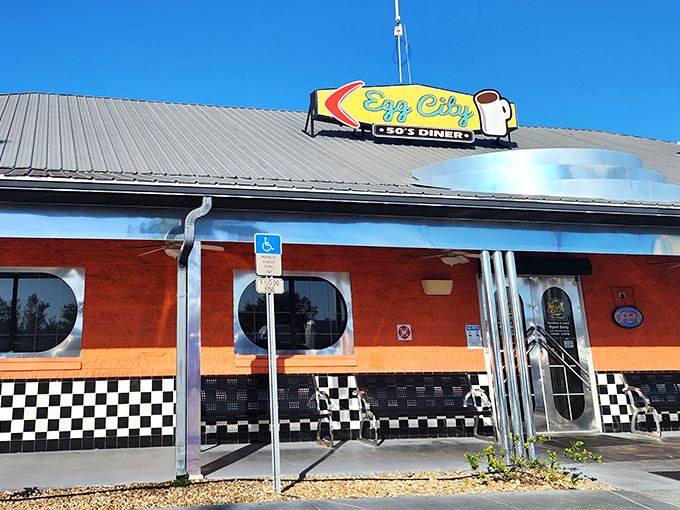 The vibrant orange exterior with its classic checkered trim isn't just eye-catching—it's a beacon of breakfast hope for hungry travelers on Florida's highways.