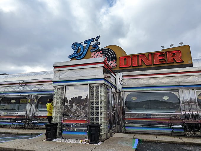The gleaming silver exterior of DJ's isn't just a diner—it's a time machine with neon signs instead of buttons and dials.