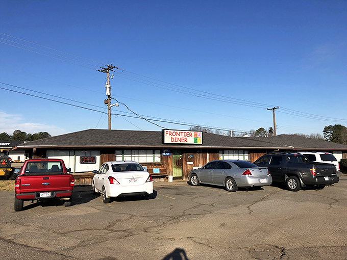 The unassuming exterior of Frontier Diner might not scream "culinary destination," but those pickup trucks don't lie—locals know where the good stuff is.