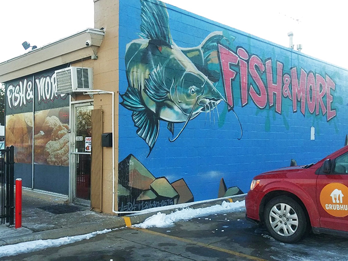 The unassuming exterior of Fish & More might not scream "culinary destination," but locals know true seafood treasures await behind that neon "OPEN" sign.