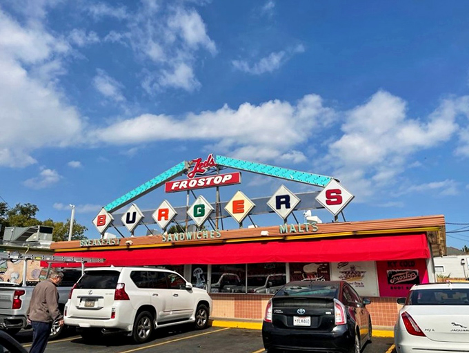 That iconic blue and red Frostop sign isn't just a landmark—it's a promise of burger bliss waiting just beyond those doors. 