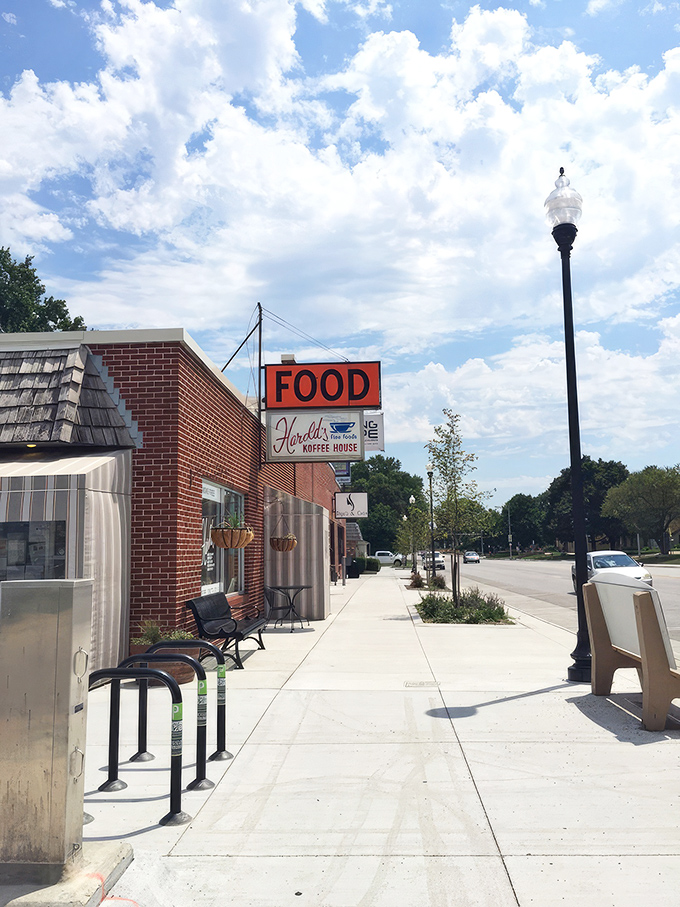 The iconic orange "FOOD" sign has been guiding hungry Nebraskans to Harold's Koffee House for generations, a beacon of comfort in Florence's historic district.