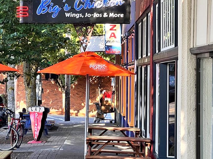 The bright red exterior with vibrant orange umbrellas isn't just eye-catching—it's nature's way of signaling something delicious awaits inside.