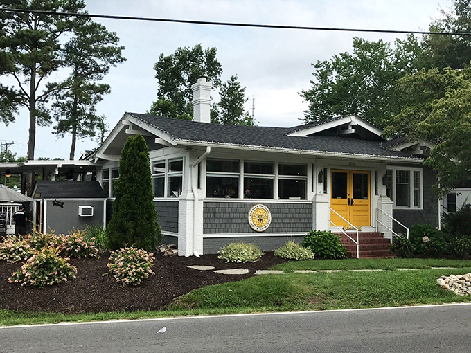Those bright yellow doors aren't just a design choice—they're a beacon calling breakfast lovers home to this charming Virginia Beach cottage.