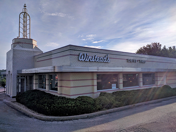 The iconic Art Deco exterior of Winstead's stands like a time capsule of Americana, complete with that distinctive tower that says "good food happens here."
