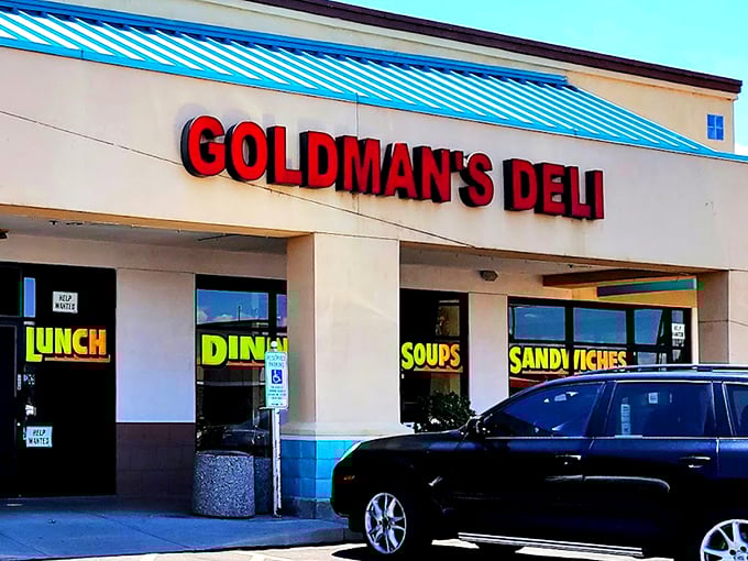 The bright red sign of Goldman's Deli stands out like a beacon of hope for the hungry and homesick. Comfort food paradise awaits!