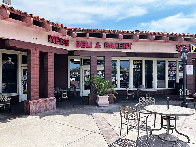 The pink-hued exterior of Weiss Deli beckons like a mirage in the Nevada desert—a promise of East Coast comfort in the most unexpected place.