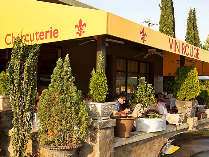 The golden-hued awning and potted cypress trees create a Provençal illusion so convincing, you'll check your passport to confirm you're still in Durham.