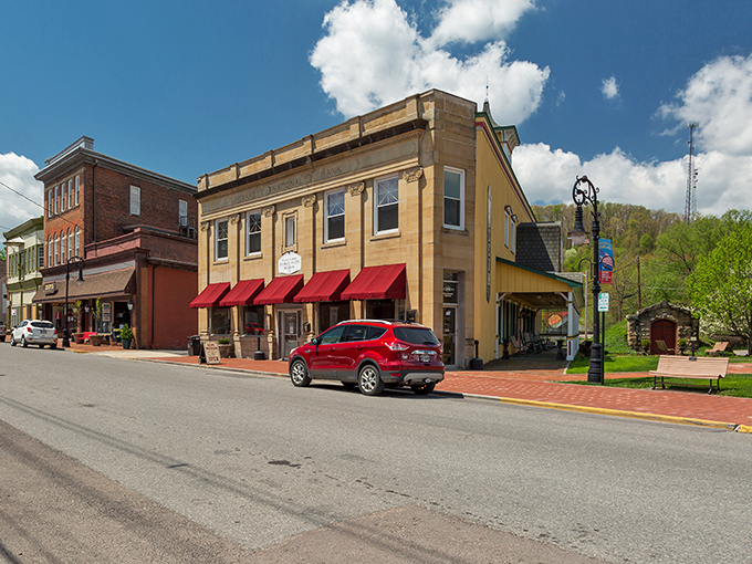 Historic brick buildings with bright red awnings line Oakland's main street – small-town charm that's aged like a fine wine.