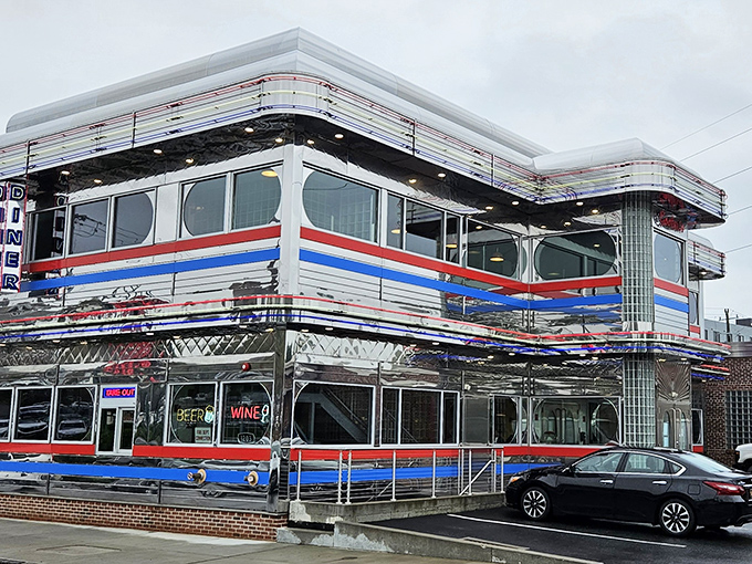 Goobers Diner gleams like a chrome-plated time machine with its red, white, and blue stripes announcing "America, served daily with a side of nostalgia."