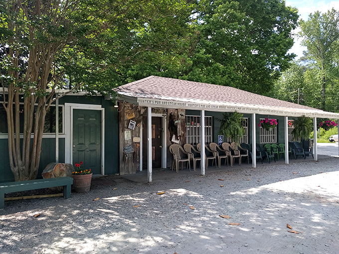 The unassuming exterior of Hunters Pub might fool you—but those hanging flower baskets and packed porch are telltale signs of culinary greatness within.