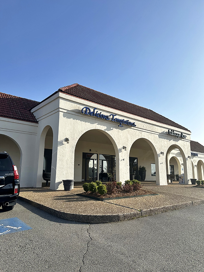 The white stucco exterior with Spanish-style arches might not scream "breakfast paradise," but locals know this unassuming building houses morning magic.