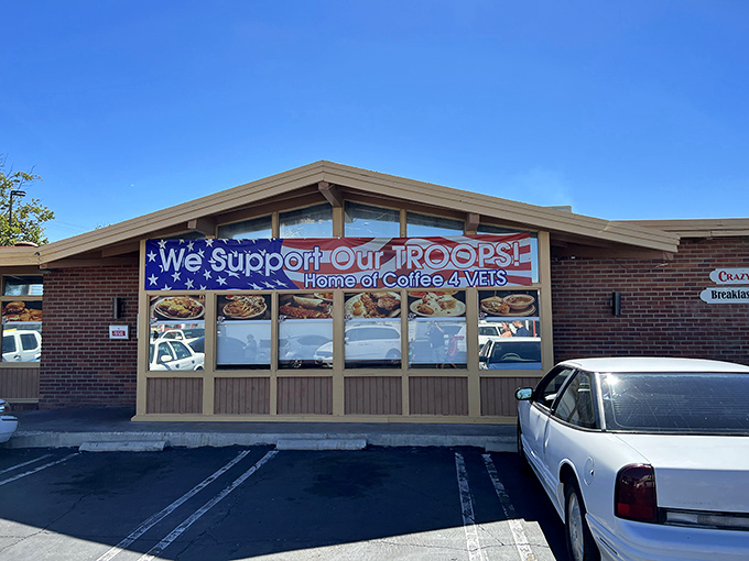 Patriotism meets pancakes at Crazy Otto's exterior. The "We Support Our TROOPS" banner reminds us that good diners are community cornerstones.
