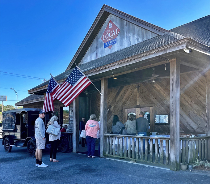 The rustic charm of The Local on 17 beckons from the roadside like a siren song for steak lovers. That weathered wood exterior hides culinary treasures within.
