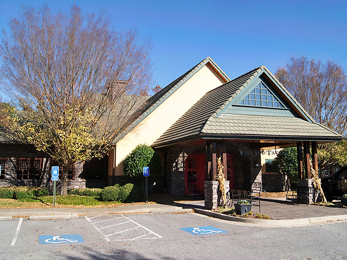 Those iconic red doors might as well have a sign that reads "Prime Rib Pilgrimage Starts Here." The stone façade and peaked roof promise comfort before you even step inside.