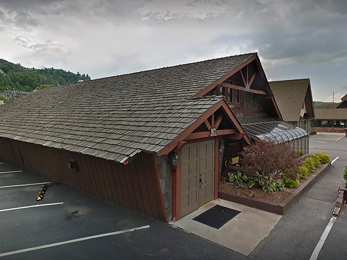 The rustic cabin exterior with its weathered shingles and iconic 1972 entrance doesn't just whisper "come in" – it practically shouts "carnivorous nirvana awaits!"