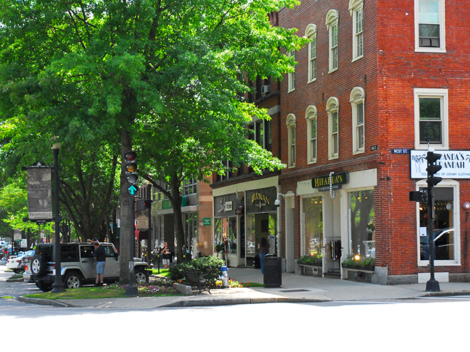 Downtown Keene's colorful storefronts welcome visitors with New England charm. Those awnings aren't just pretty—they're perfect for window shopping in any weather.