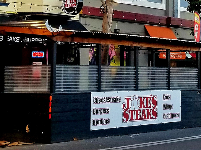 The unassuming storefront of Jake's Steaks beckons with its straightforward promise: "Cheesesteaks, Burgers, Fries, Wings, Craft Beers." No frills, just thrills.
