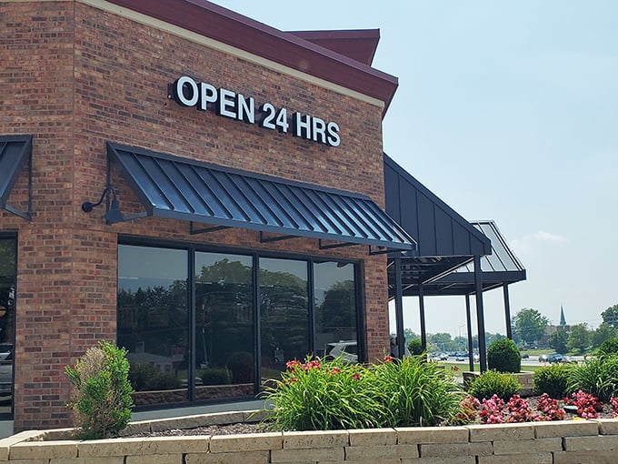 The brick exterior of Gingham's proudly announces "OPEN 24 HRS" – a beacon of hope for hungry night owls and early birds alike.