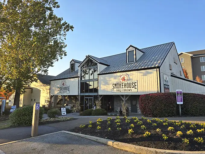 The barn-inspired exterior of Smokehouse BBQ & Brews stands proudly against the Pennsylvania sky, a beacon of smoked meat salvation in Amish Country.