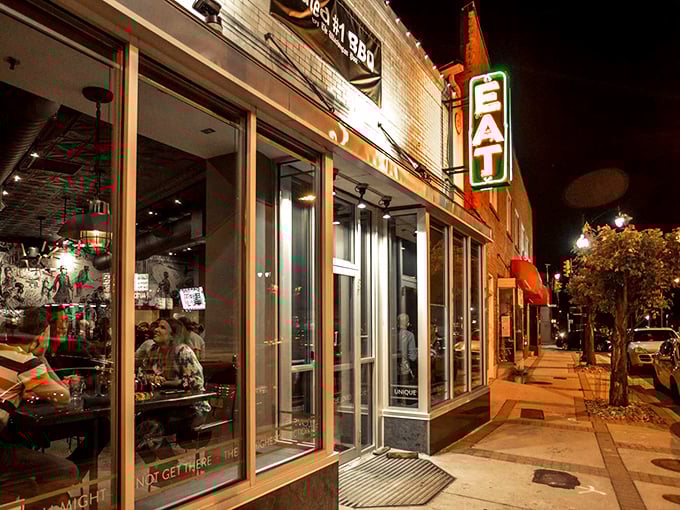 The inviting exterior of Texas Jack's Barbecue beckons with its vintage-style neon sign—like a beacon of smoky salvation on Arlington's Washington Boulevard.