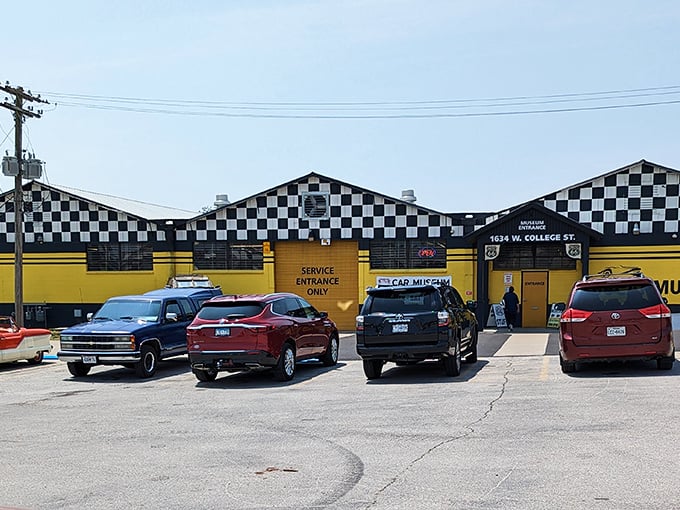 The checkered-flag exterior of Route 66 Car Museum practically screams "START YOUR ENGINES!" – a roadside beacon for automotive enthusiasts in Springfield.