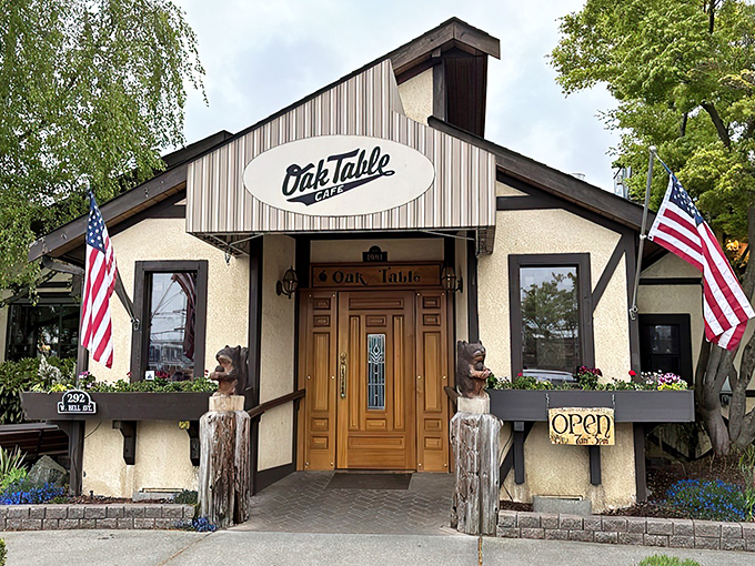 The timber-framed facade of Oak Table Cafe welcomes you like a breakfast hug. Those hanging flower baskets aren't just pretty—they're signaling that good taste awaits inside.