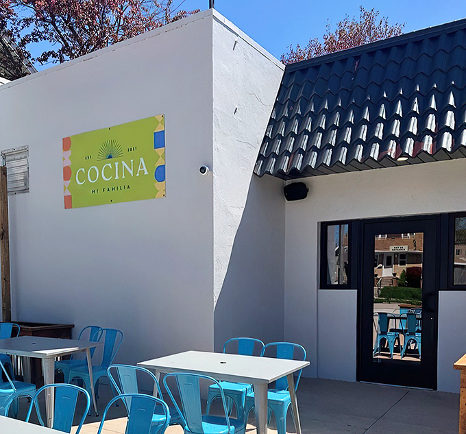 The unassuming white exterior with cheerful blue chairs hints at the culinary treasures within. Like finding a diamond in Wisconsin's cheese country.