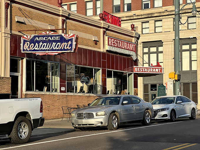 That iconic red exterior isn't just a building—it's a time machine disguised as Memphis's oldest café. The neon practically winks at you.