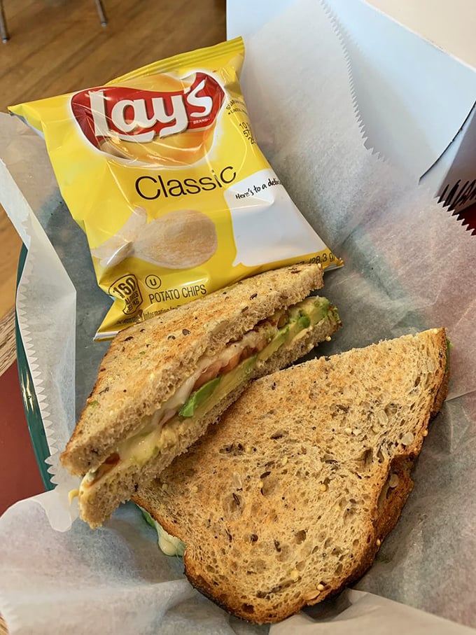 The sandwich that launched a thousand lunch breaks – multigrain bread, fresh vegetables, and the promise of potato chips on the side.