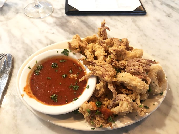 Golden-fried calamari that's crispy on the outside, tender within—the kind that makes you wonder why you ever settled for rubbery rings elsewhere.