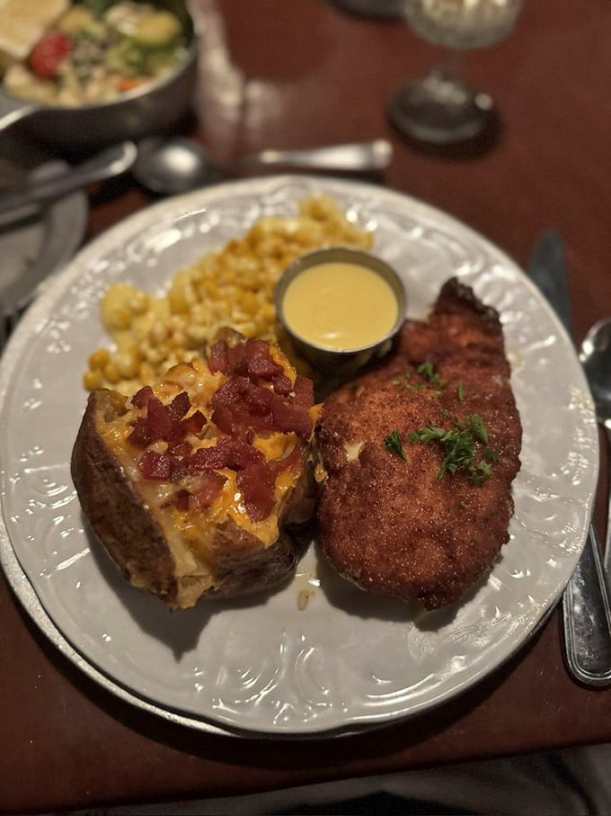 A loaded baked potato and perfectly breaded cutlet—proof that sometimes the classics endure because they're simply unbeatable, like The Beatles or comfortable shoes.