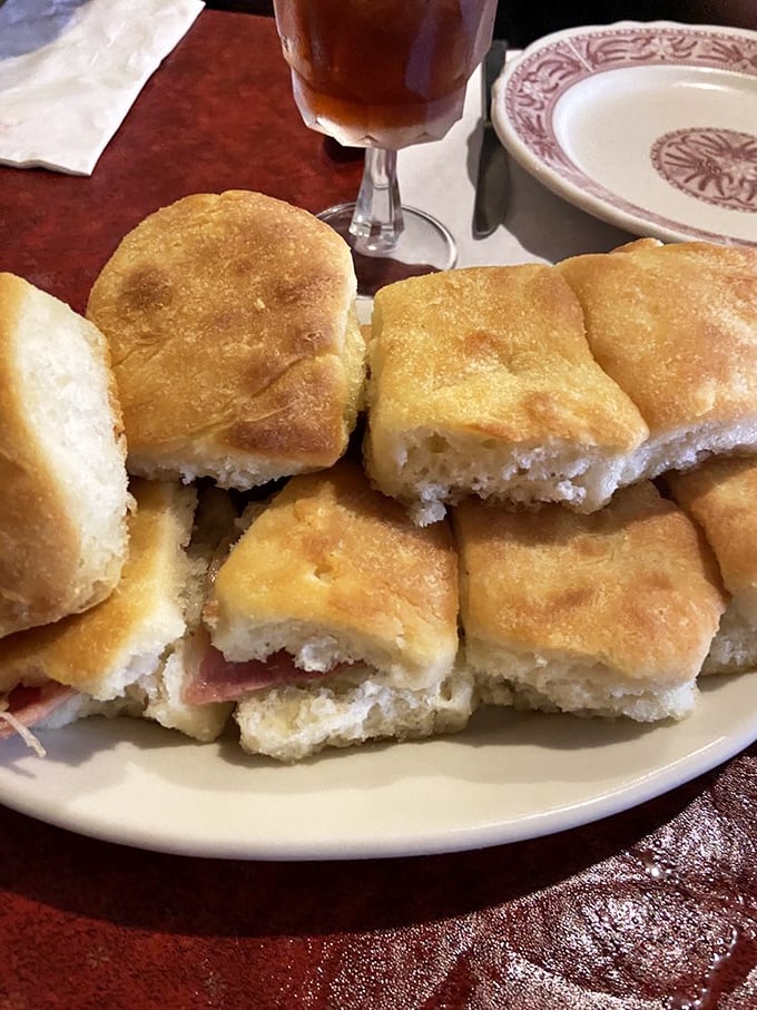 Country ham biscuits arranged like edible dominoes—one falls into your hand, then your mouth, then suddenly they're all gone.