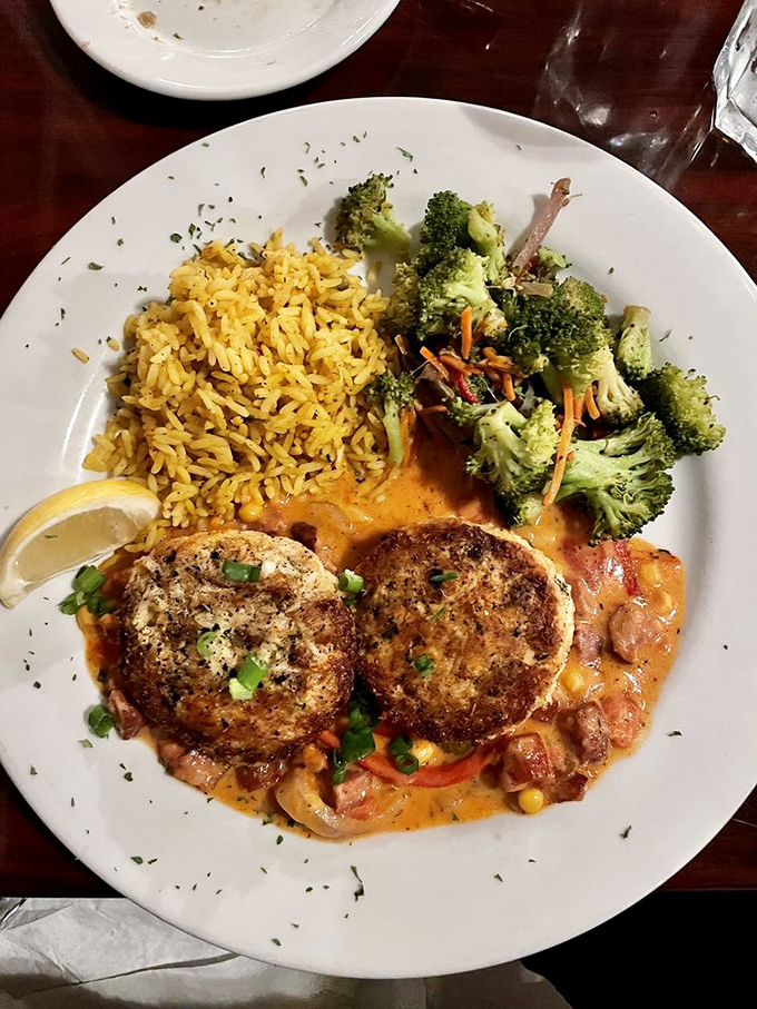 These aren't just crab cakes—they're edible evidence that sometimes the best things in life come in pairs, especially when served with rice and broccoli.