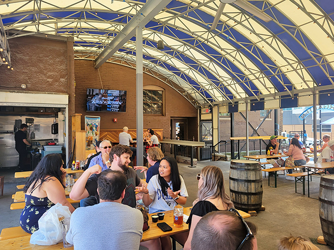 Under the translucent roof, strangers become friends and friends become family—the universal magic of breaking bread and raising glasses.