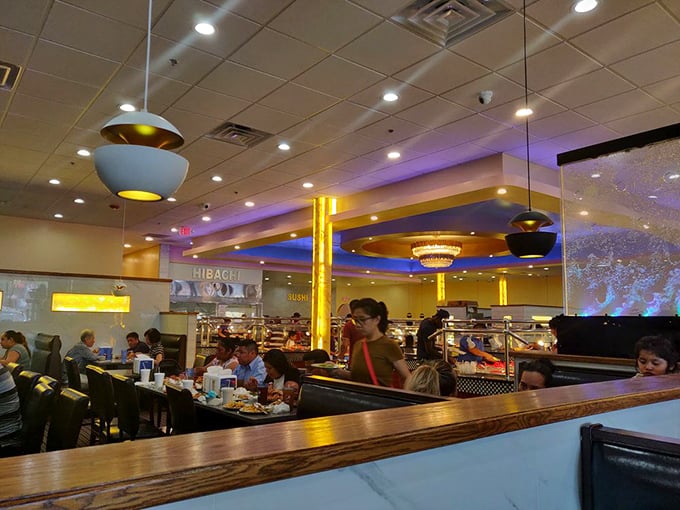Families and friends gather in booths beneath the soft lighting, where conversations flow as freely as the sweet tea and second helpings.
