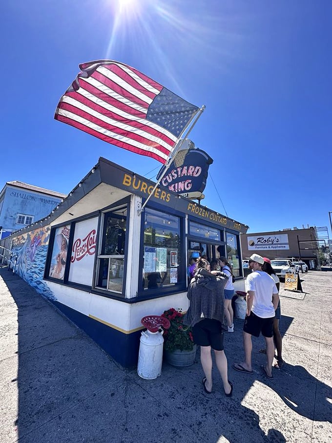Pilgrims line up under the American flag, united in their quest for the creamiest custard on the Oregon coast.