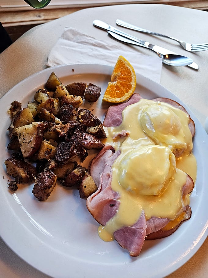 Eggs Benedict: where hollandaise dreams come true. Those potatoes didn't just get seasoned—they got therapy, love, and attention.