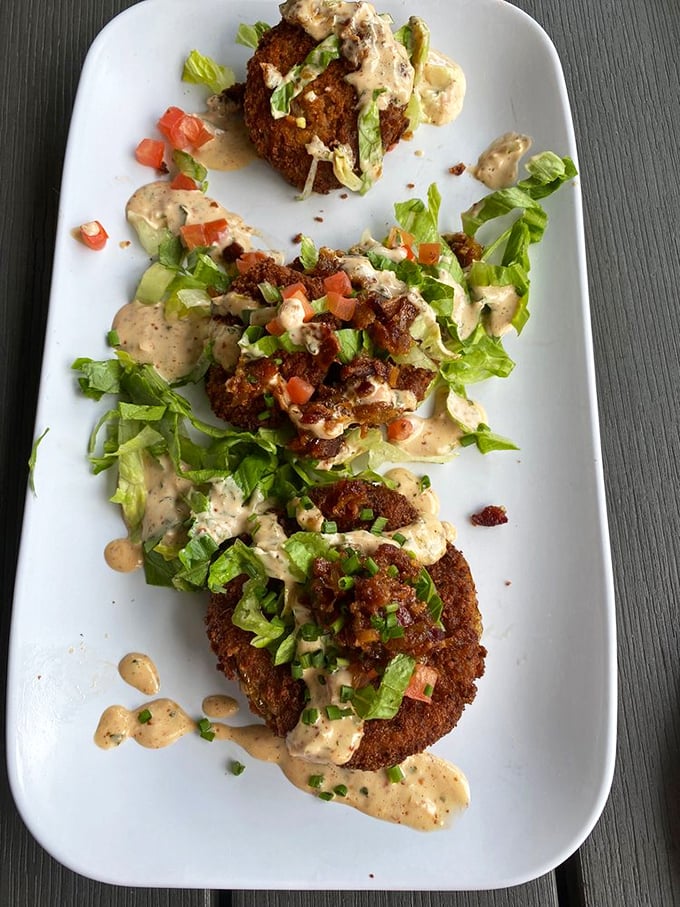 These aren't just fried green tomatoes—they're Southern tradition elevated with a creamy sauce that makes vegetables feel like an indulgence.