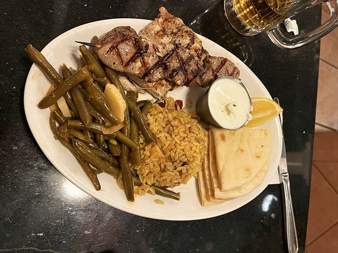The Grecian Mixed Grill—where perfectly seasoned meat meets the company of rice and green beans. A trio that performs in perfect harmony.