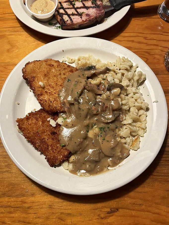 Jägerschnitzel with mushroom sauce so good you'll want to bathe in it. The spätzle on the side is the perfect dance partner.
