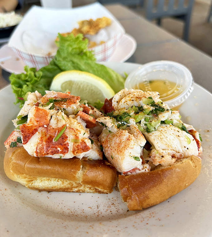 A proper lobster roll that doesn't hide behind fancy ingredients—just sweet meat, light seasoning, and a perfectly toasted bun.