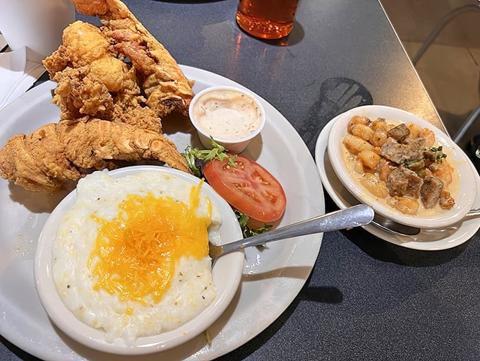 Fried lobster tail with cheese-laden grits and sausage gravy. The breakfast of champions—if those champions plan to nap immediately afterward.