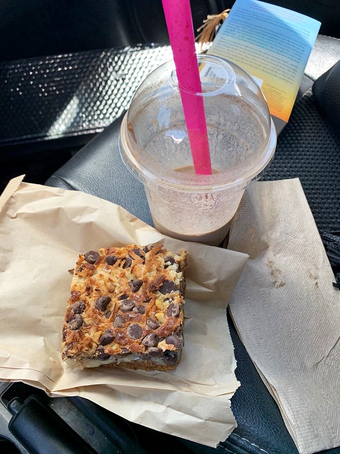 Road trip sustenance that elevates the entire journey. This magic bar and iced coffee combo turns your car into a rolling café with mountain views.