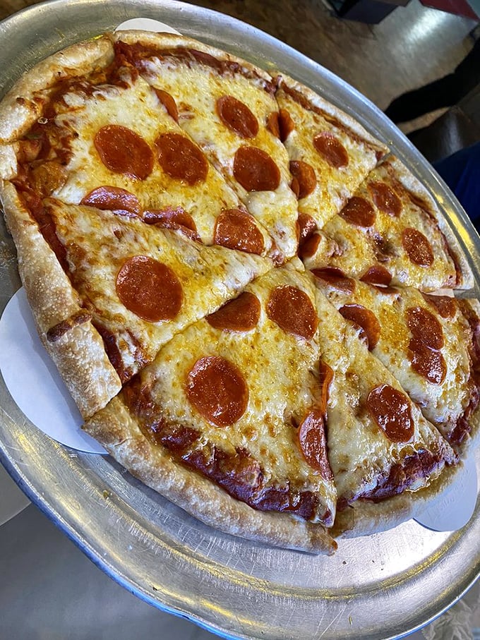 Pepperoni pizza that makes you understand why this topping became America's sweetheart—crisp edges curling into little flavor cups.