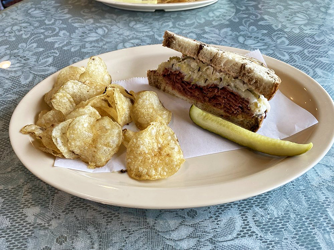 The Reuben and chips combo—comfort food's dynamic duo. This sandwich isn't just lunch; it's therapy between two slices of perfectly grilled bread.