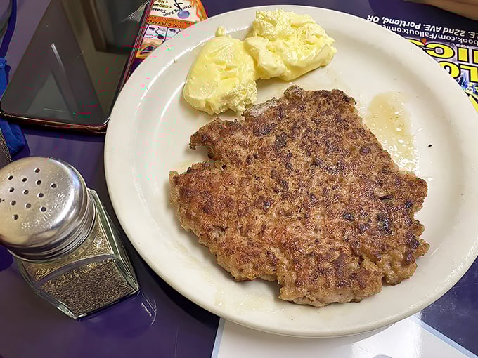 This isn't just a sausage patty – it's a testament to breakfast simplicity. Perfectly browned, waiting to fulfill its protein destiny.