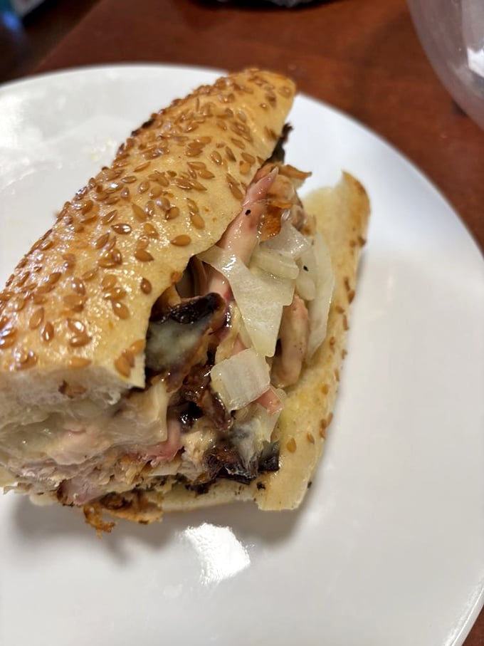 This sandwich isn't just lunch – it's architecture. Layers of smoked chicken, melty cheese, and vibrant toppings create edible engineering at its finest.