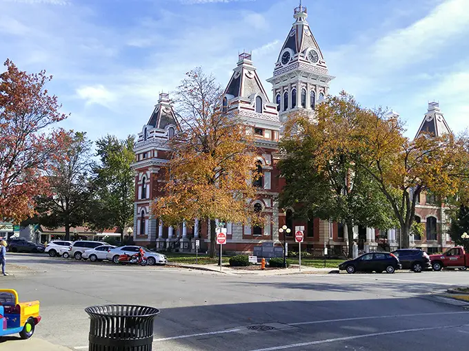 Fall drapes the courthouse in golden splendor, creating the kind of seasonal postcard moment that makes you forget all about your smartphone's weather app.
