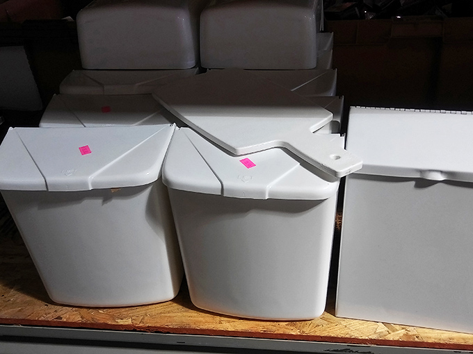 White storage bins with pink price tags—practical, pristine, and priced to move. Organization solutions that won't disorganize your budget.